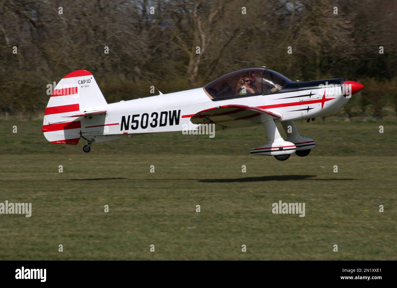 A Mudry CAP-10B sports plane takes off from Headcorn airfield Kent ...