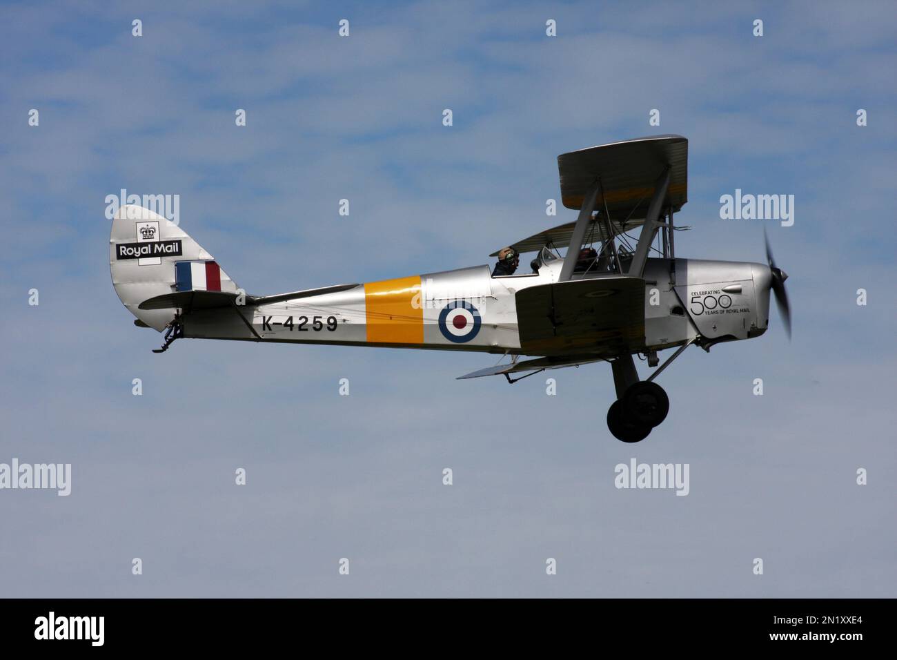 A De Havilland DH-82A Tiger Moth celebrating 500 years of Royal Mail ...