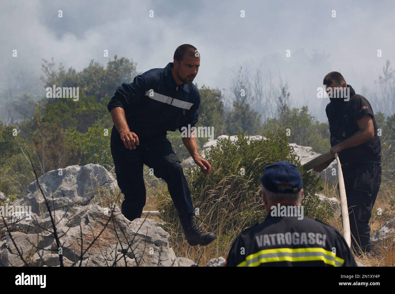 Croatian fire workers controls fire during large forest fire on the ...