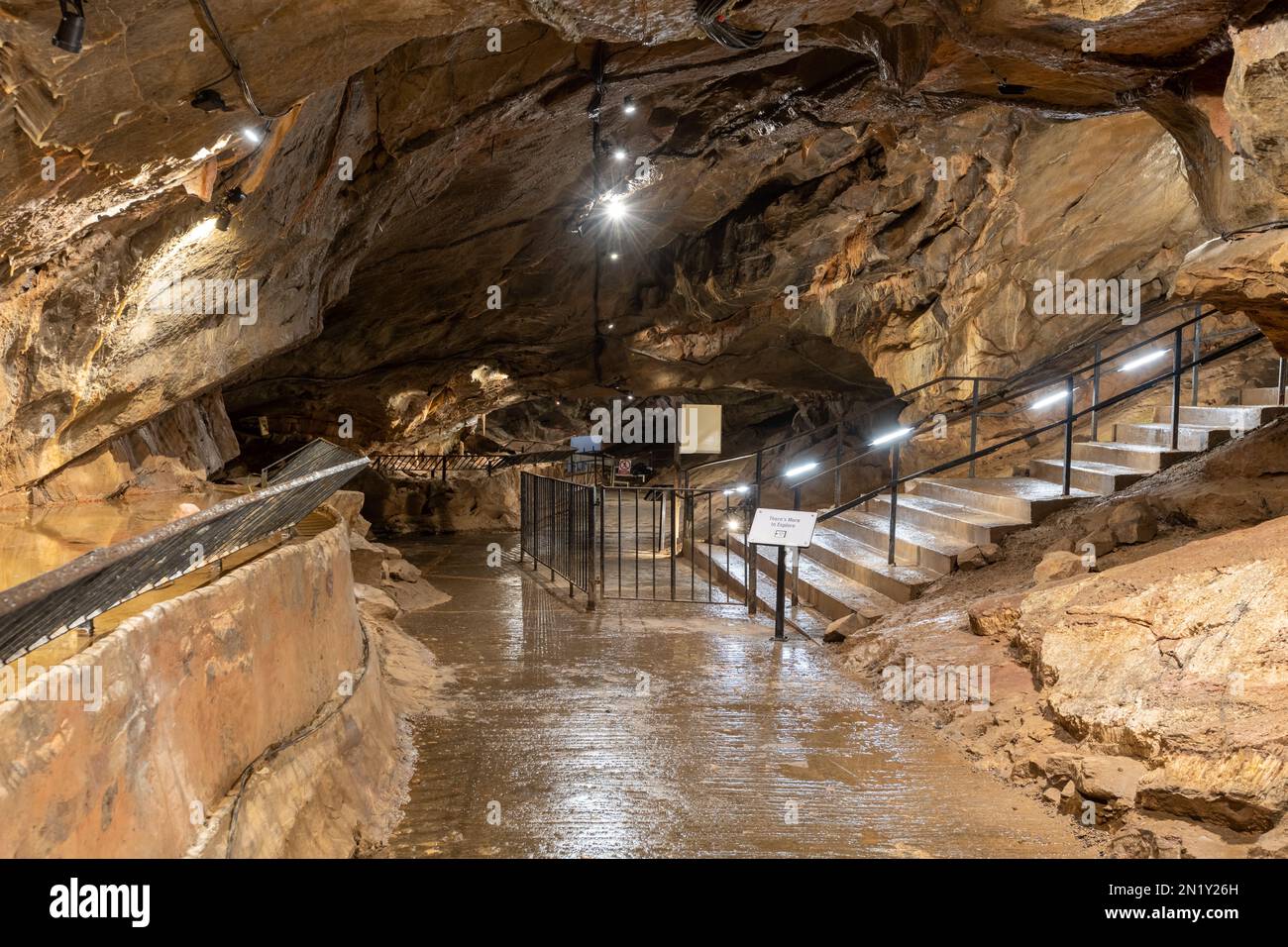 An illuminated staircase inside Goughs Cave in Cheddar in Somerset ...