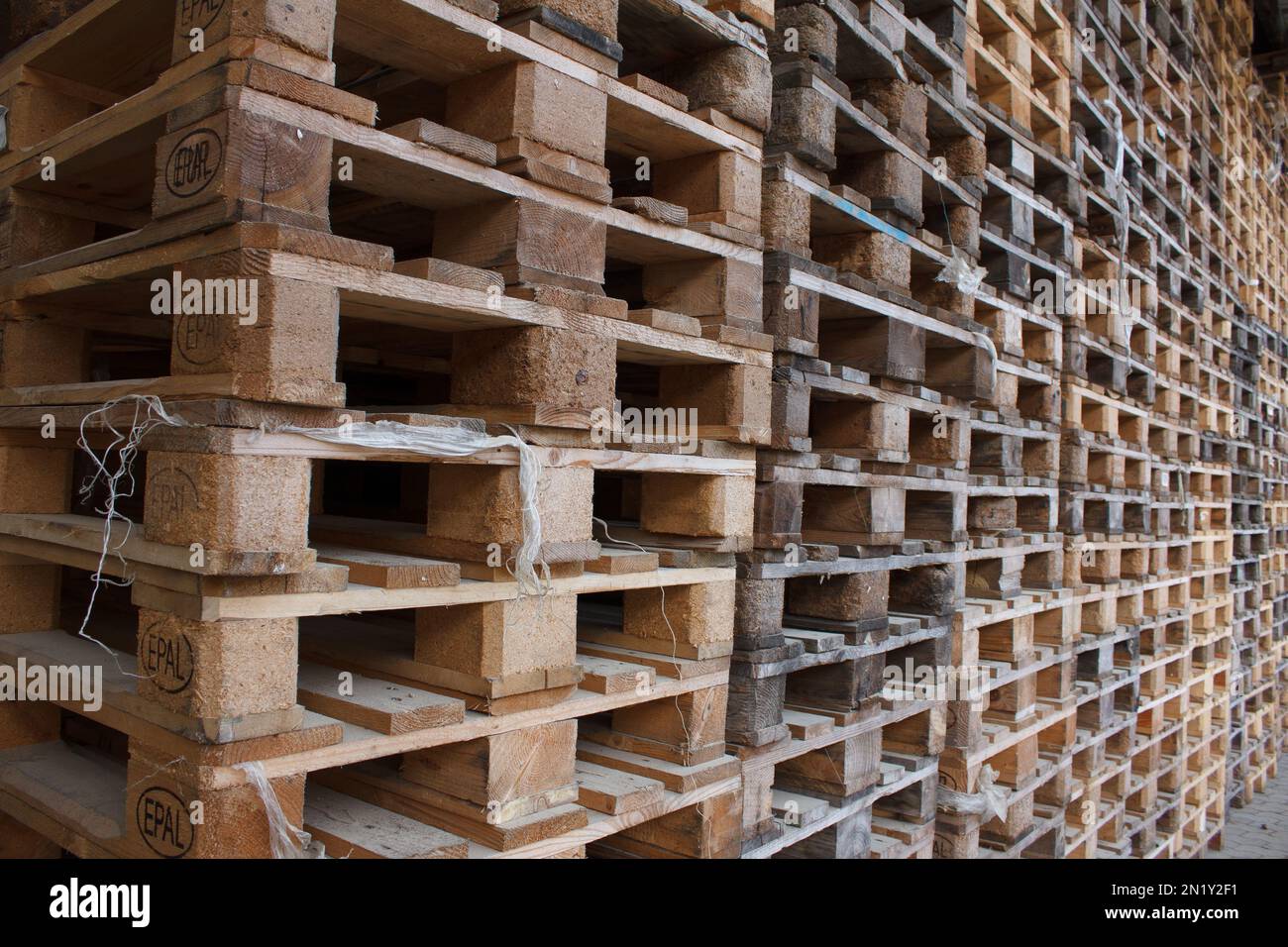 wall of stackes euro pallets outside Stock Photo - Alamy