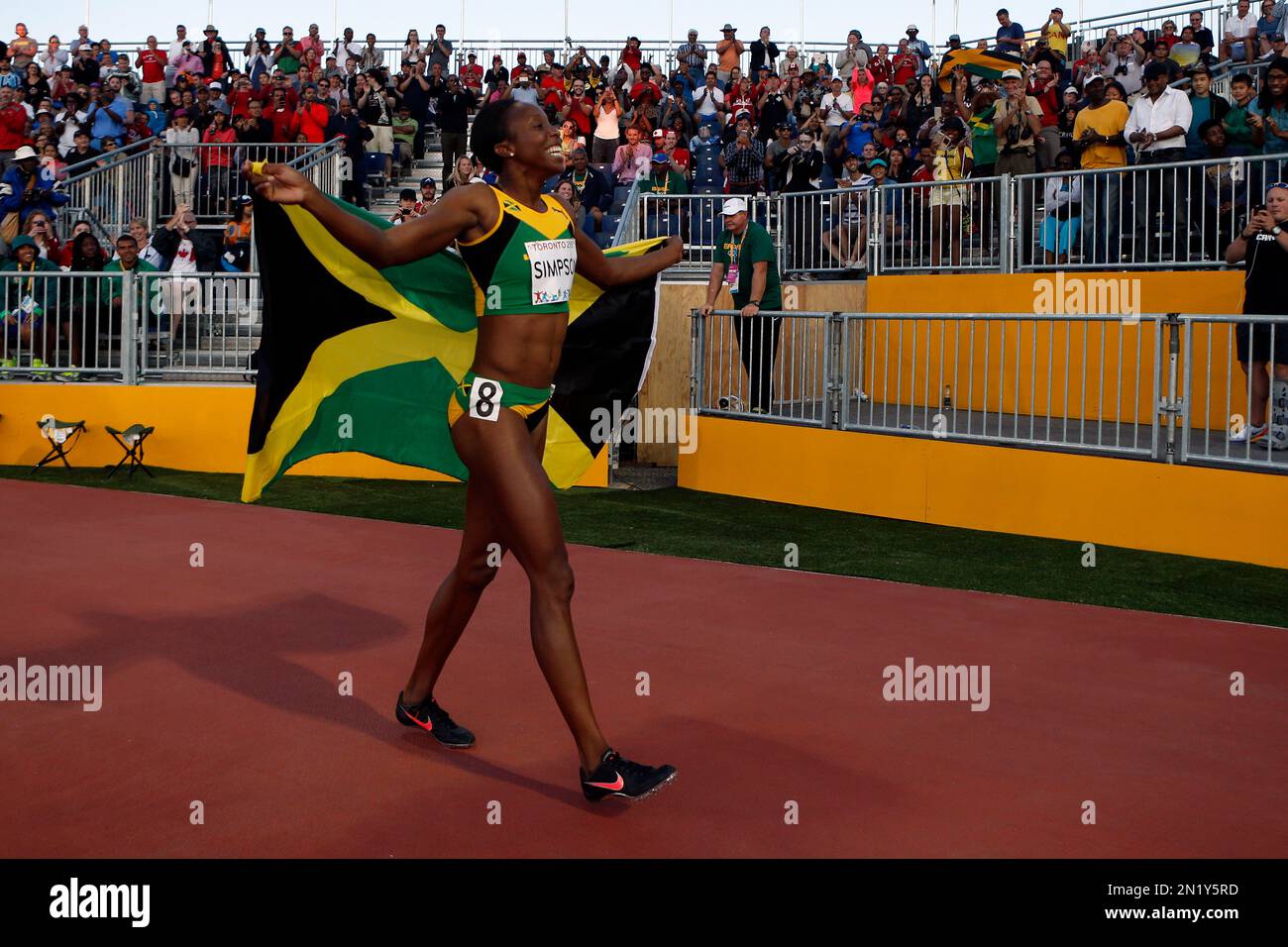 Jamaica's Sherone Simpson celebrates after winning in the women's 100 ...