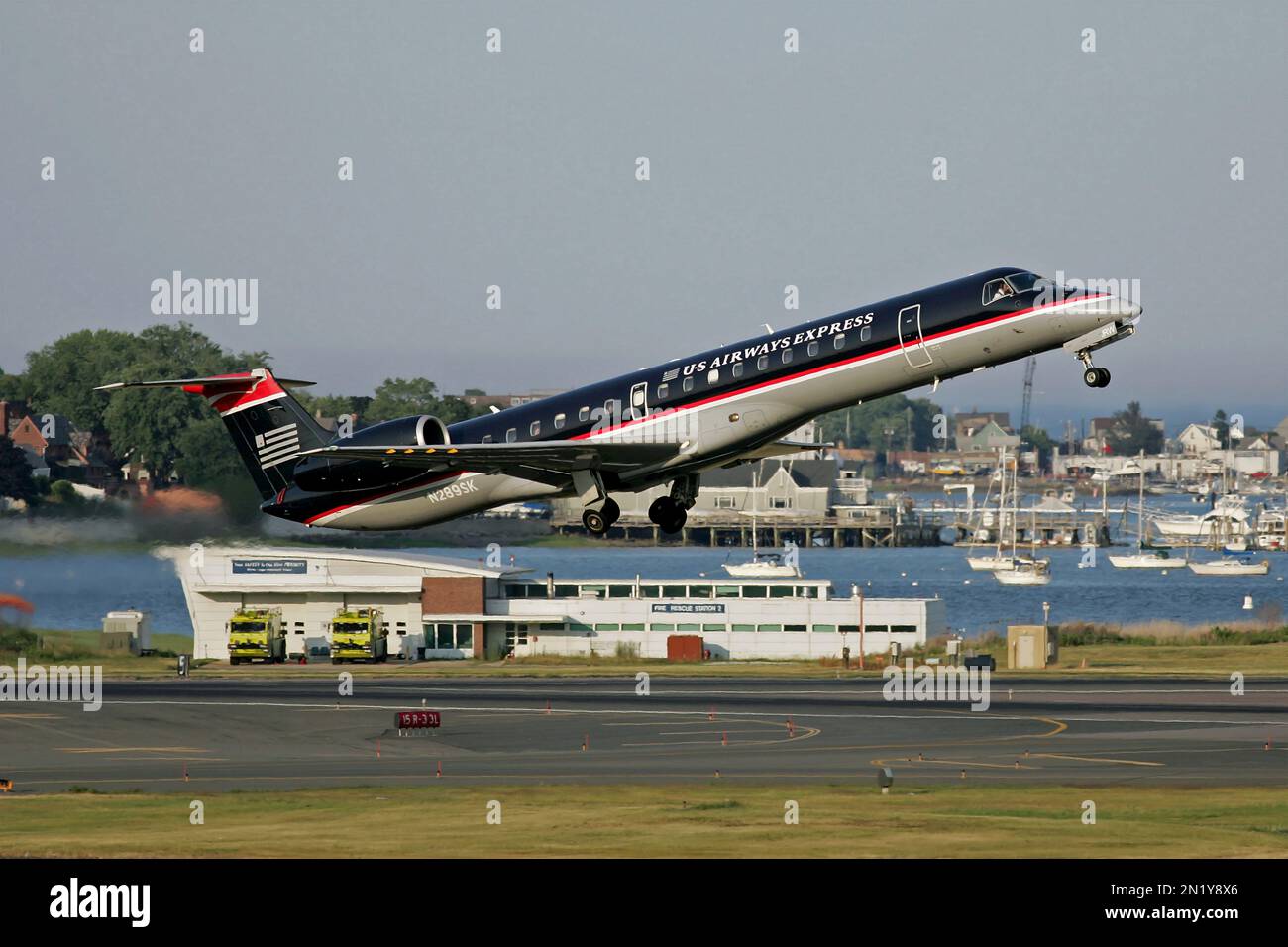 US Airways Express Embraer 145 plane taking off, Boston Harbor ...