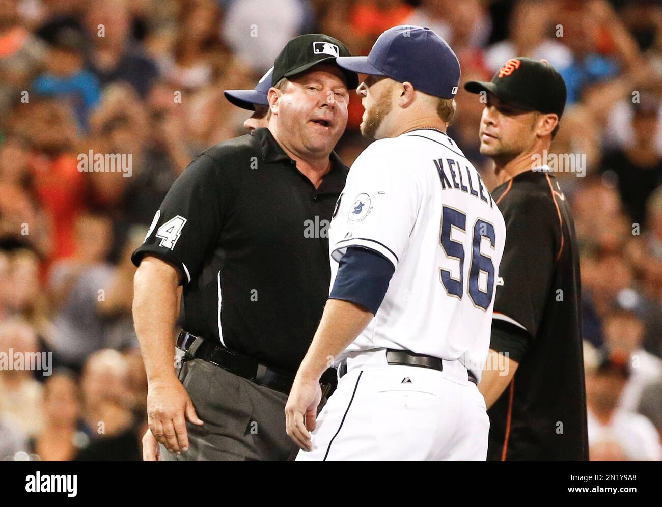 Umpire Sam Holbrook talks to San Diego Padres pitcher Shawn Kelley ...