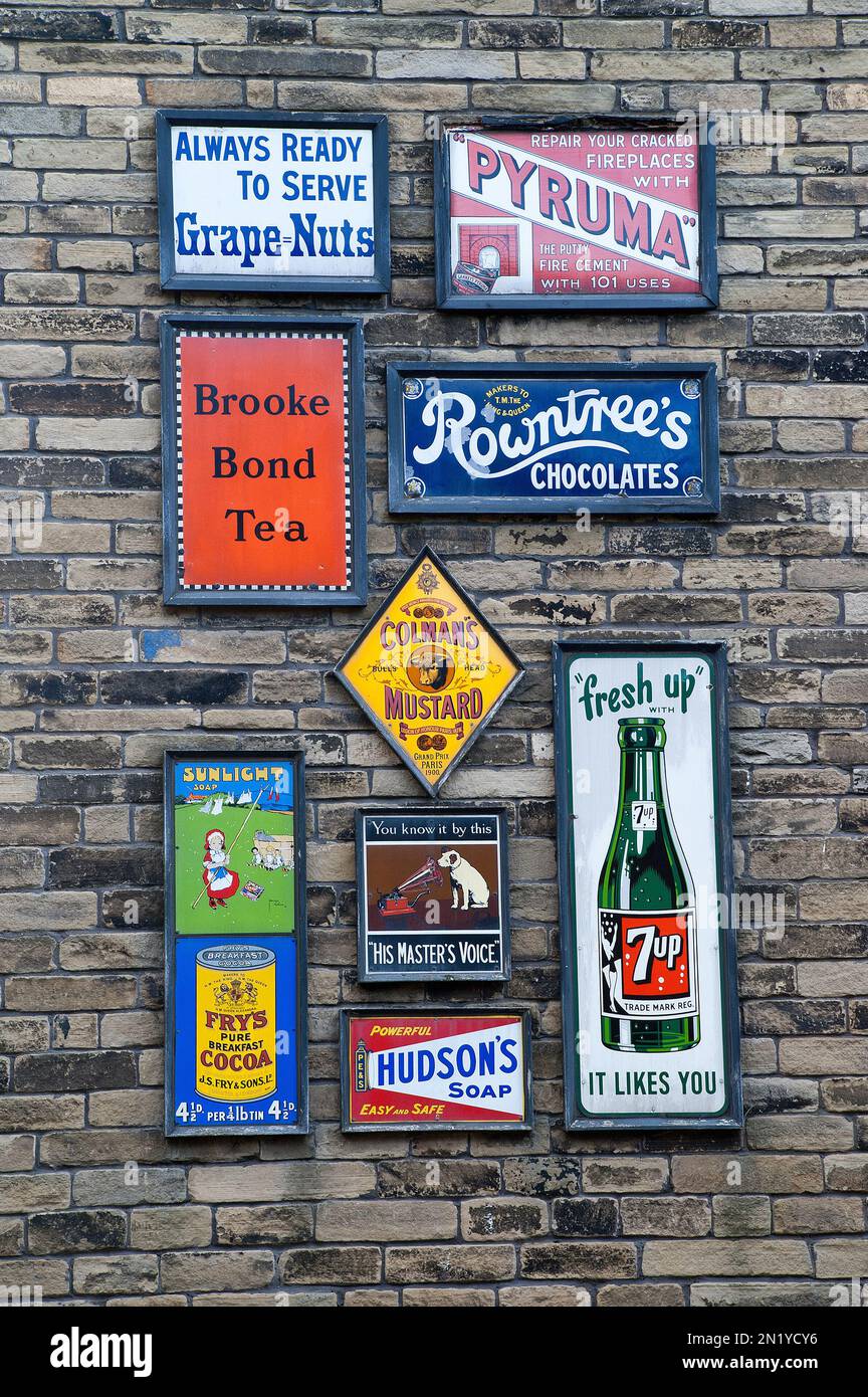 A collection of enamel signs on a wall at the Bradford Industrial ...