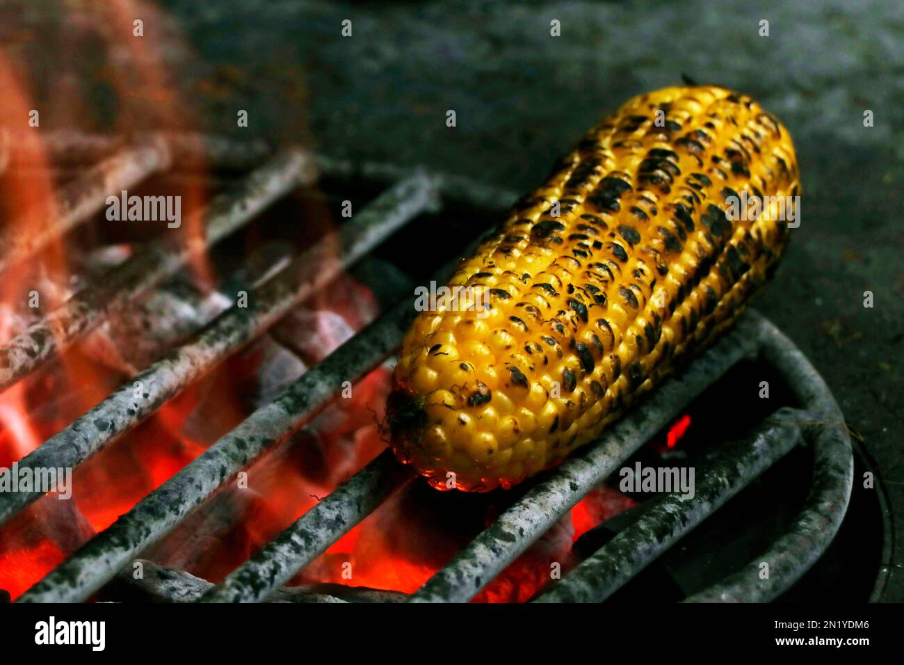 grilled corn on fire charcoal, street food delicacy Stock Photo - Alamy