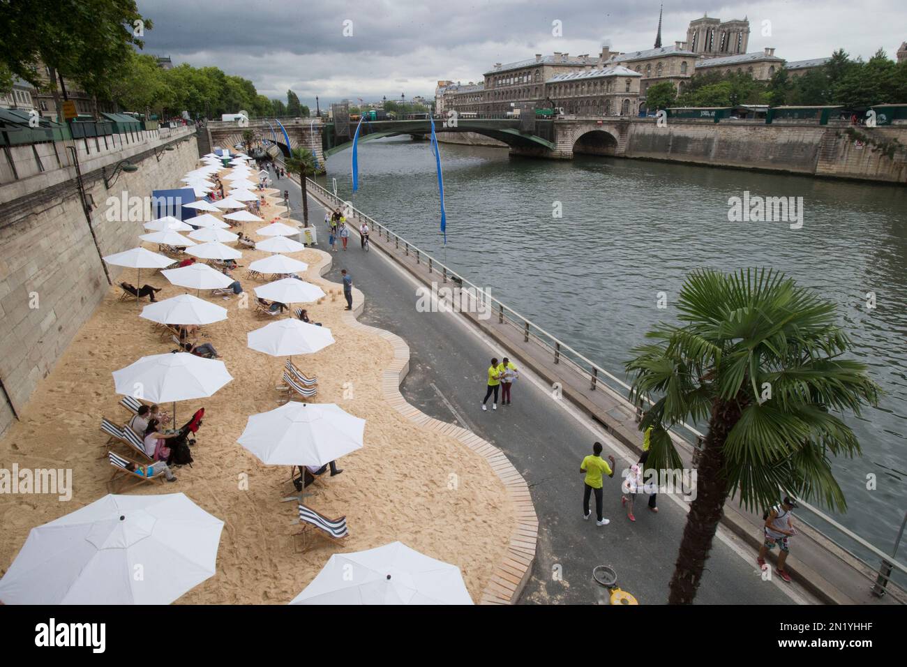 Tourists and Parisians take advantage of Paris Plage, an artificial ...