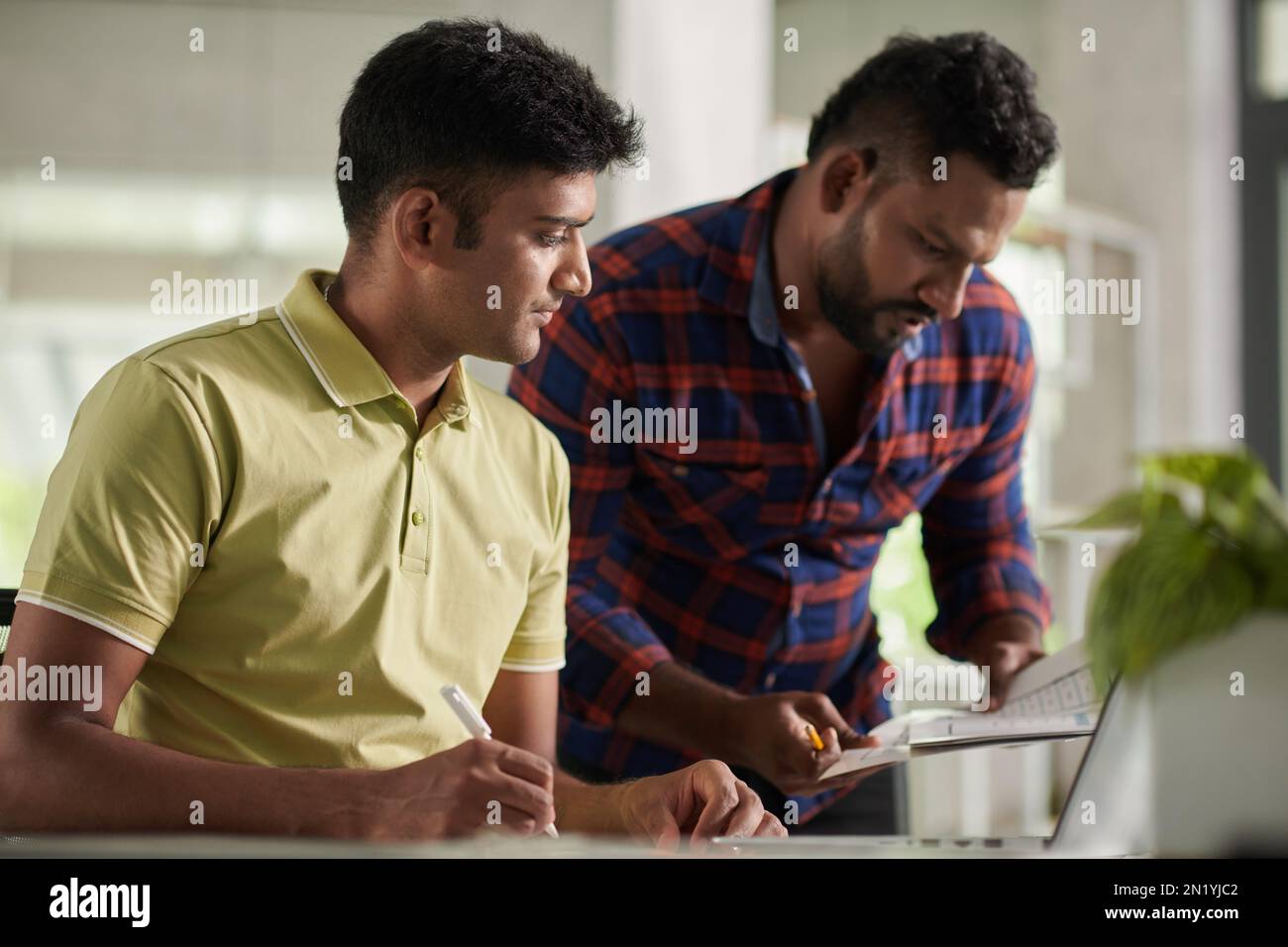 UX designer showing mockups with mobile app interface to front end ...