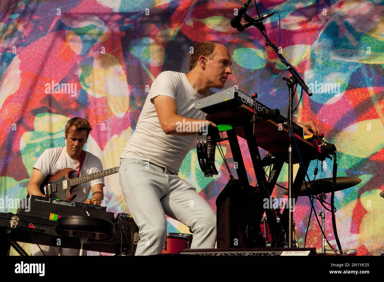 On right playing keyboards, Dan Snaith performs with band members of ...