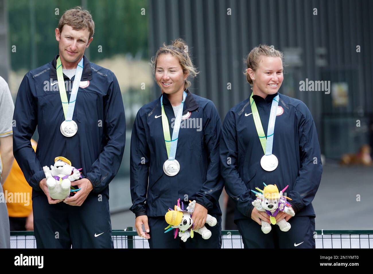 The United States' Justin Coplan, left, Caroline Patten, center, and ...