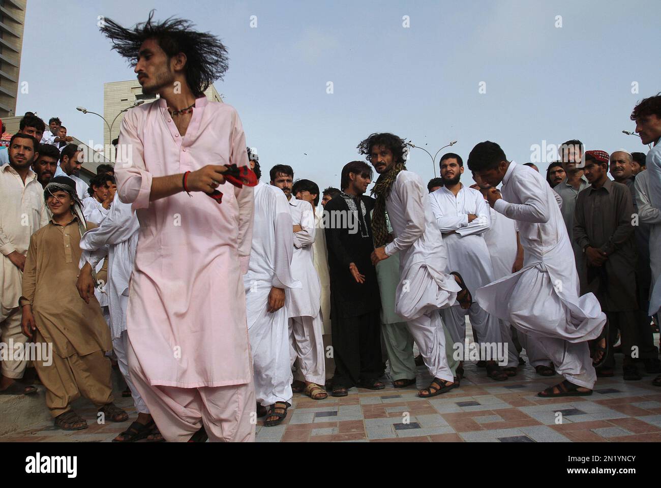 Pakistani Pashtun people perform their traditional dance at Clinfton ...
