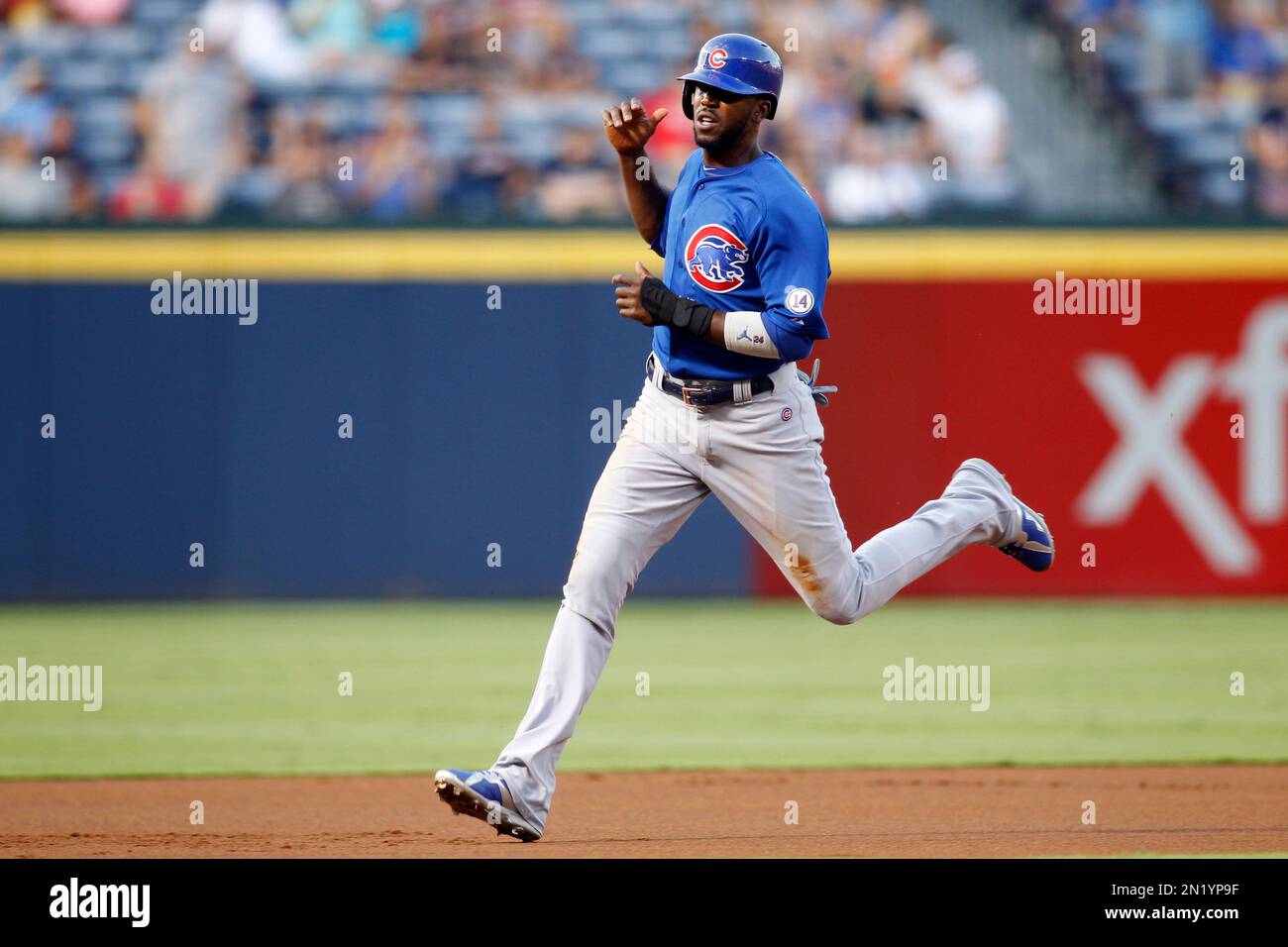 Chicago Cubs' Dexter Fowler runs to third base in the first inning of a ...