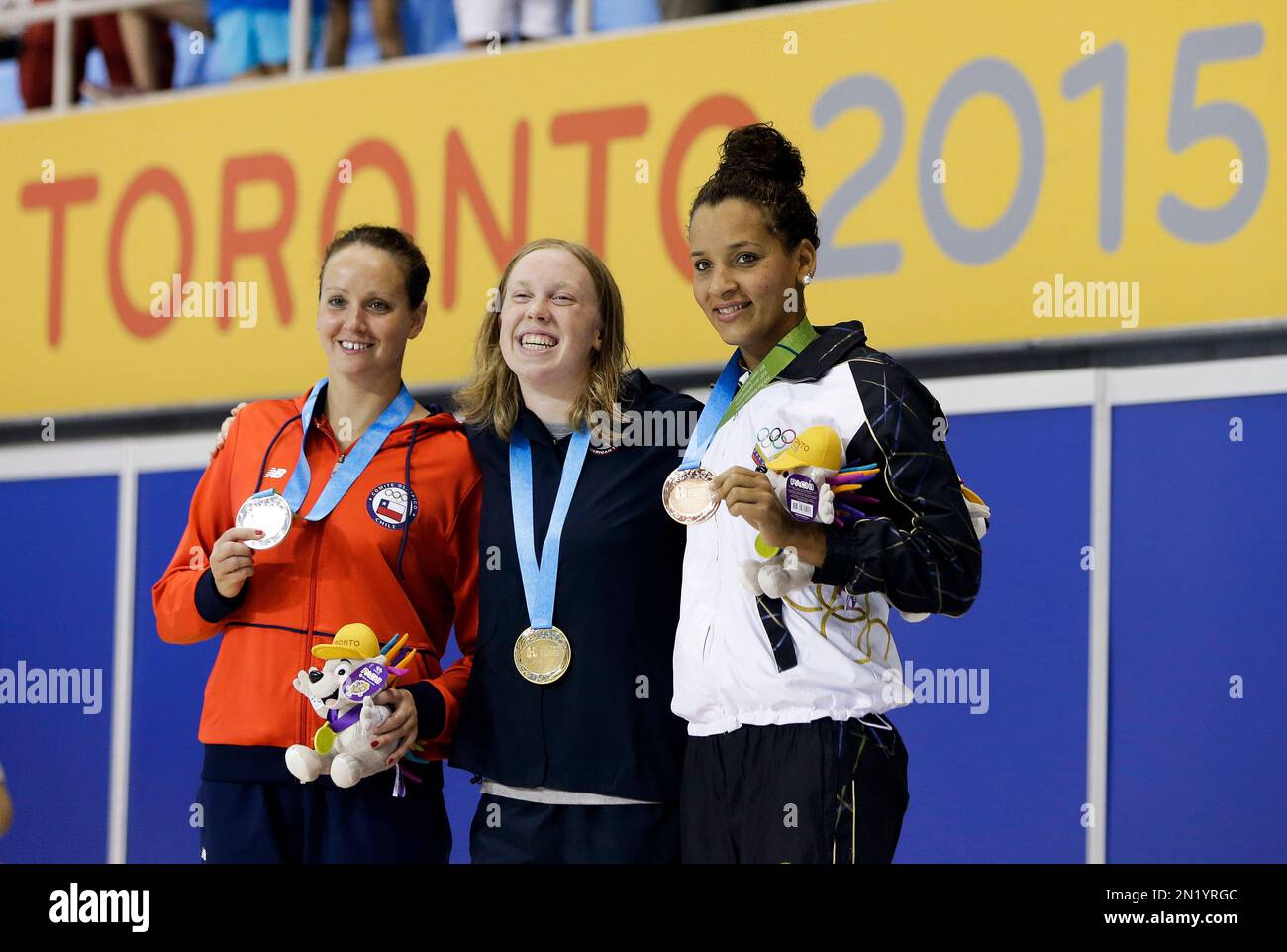 Gold medalist Sierra Schmidt, center, of the United States, poses with ...