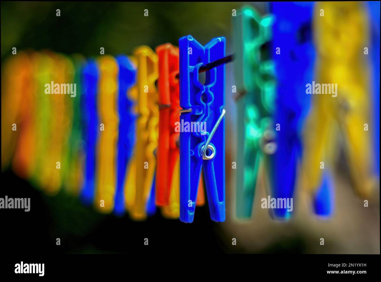 Clothespins on rope holding hi-res stock photography and images - Alamy