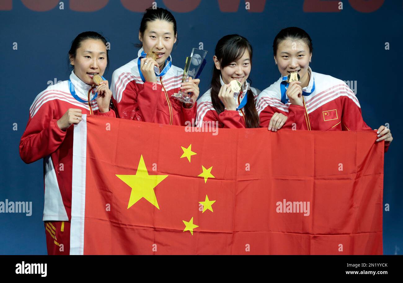 China's women's epee team pose on podium with their gold medals at the ...