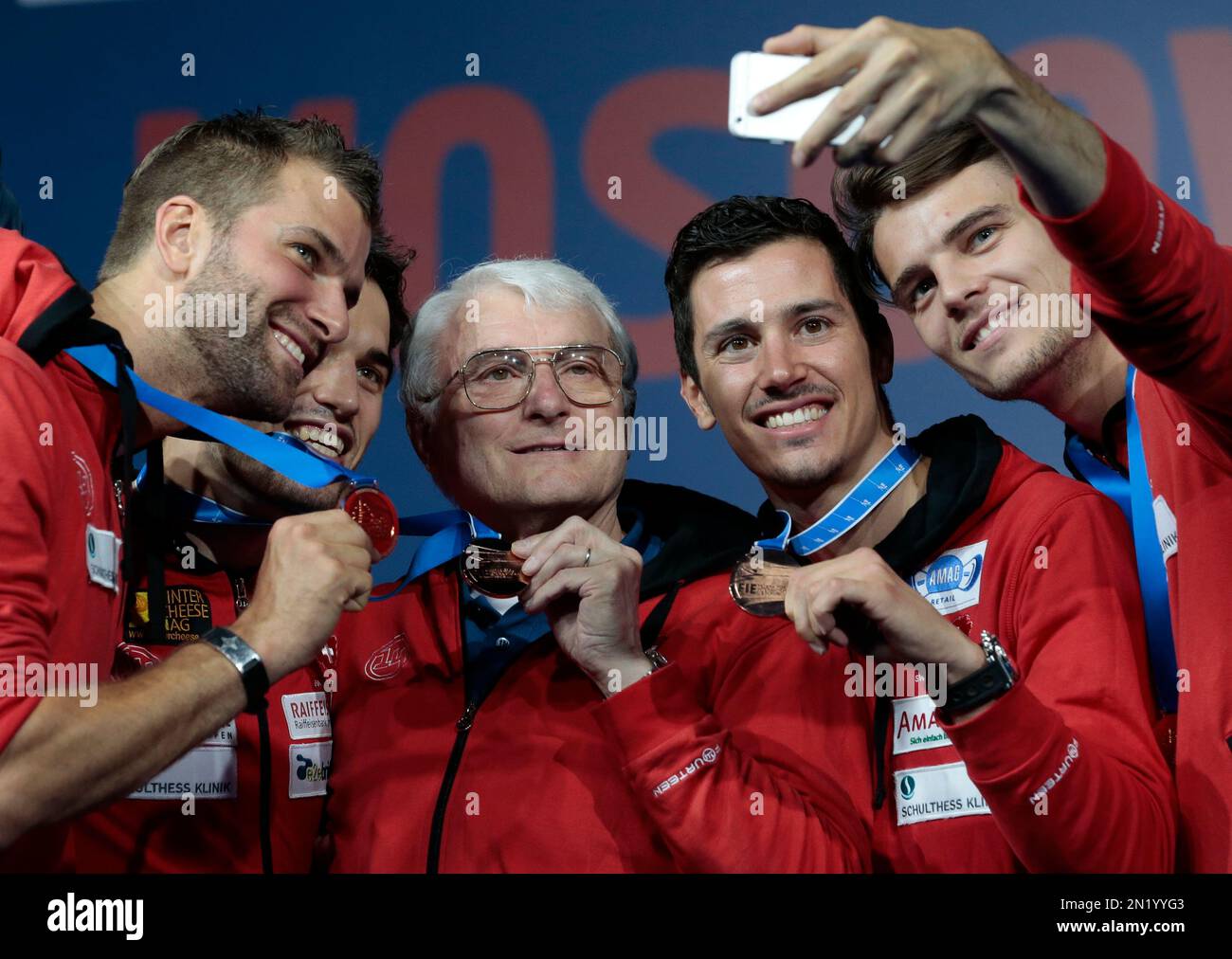 Switzerland's men's epee team pose with their bronze medals at the ...