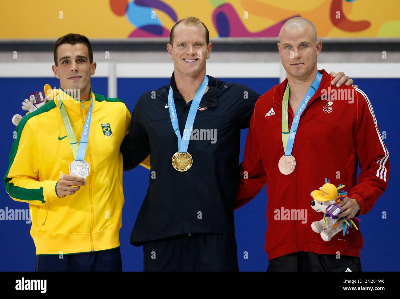Josh Schneider, center, of the United States, poses for photographers ...