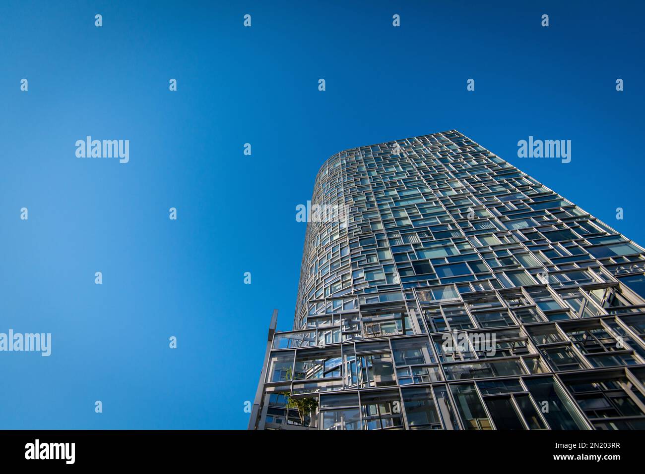 Modern futuristic office building in a big city Stock Photo - Alamy