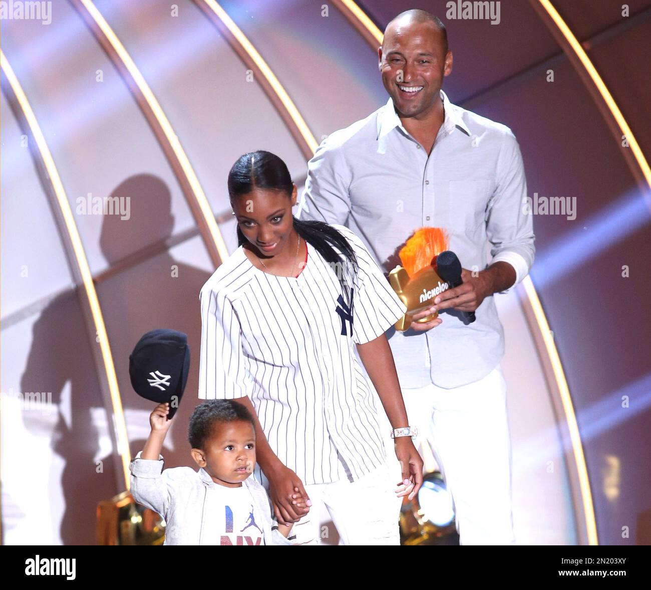 Derek Jeter, from right, accepts the legend award, with Jalen Jeter ...