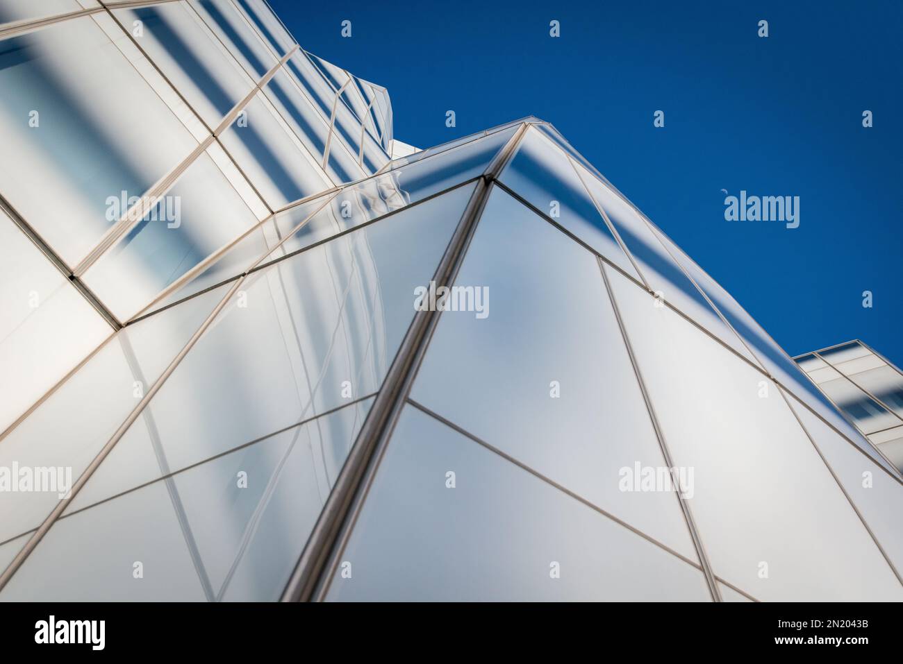 Modern futuristic office building in a big city Stock Photo - Alamy