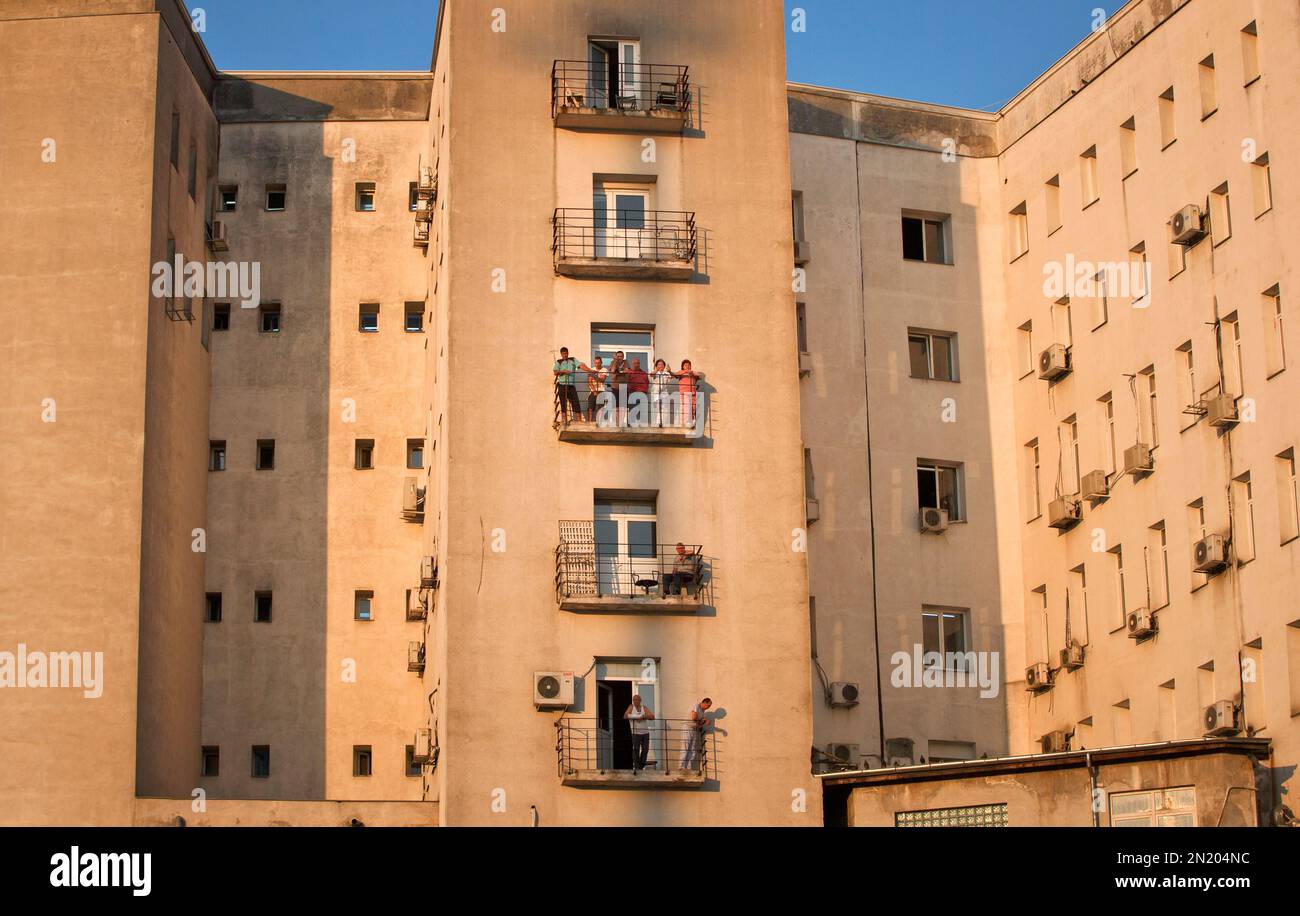 People watch from the emergency hospital building as Muslims attend Eid ...