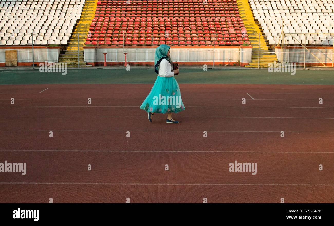 A Muslim girl arrives for Eid al-Fitr prayers in Bucharest, Romania ...