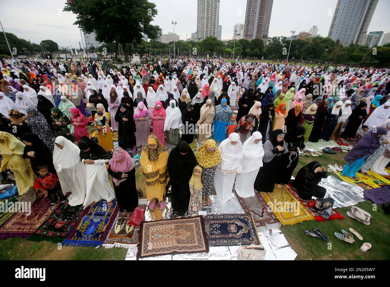 Filipino Muslims pray as they gather at Manila's Rizal Park to mark the ...