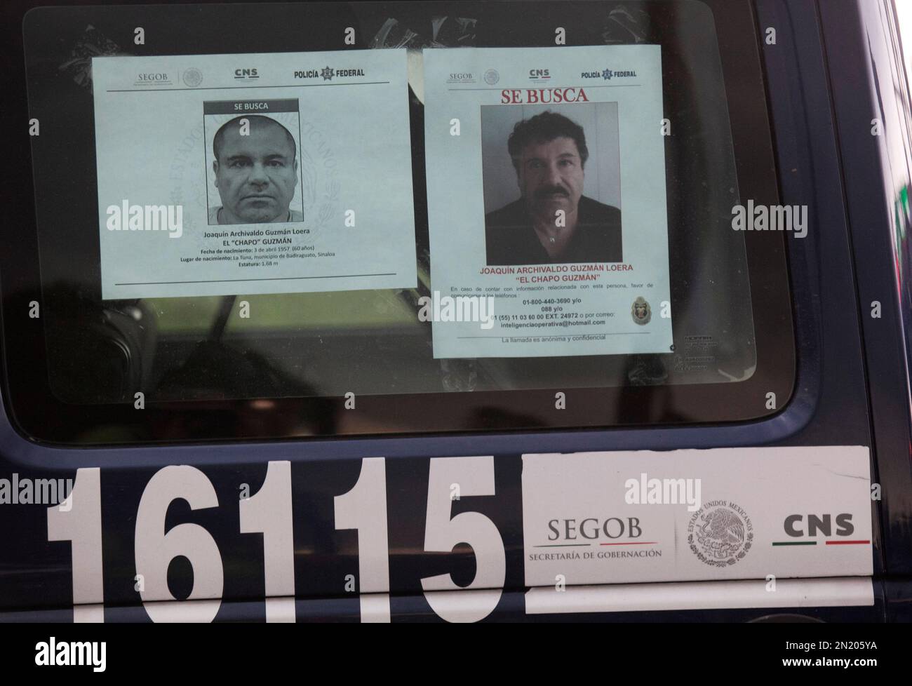 A Mexican Federal Police vehicles displays a wanted notice and a reward ...
