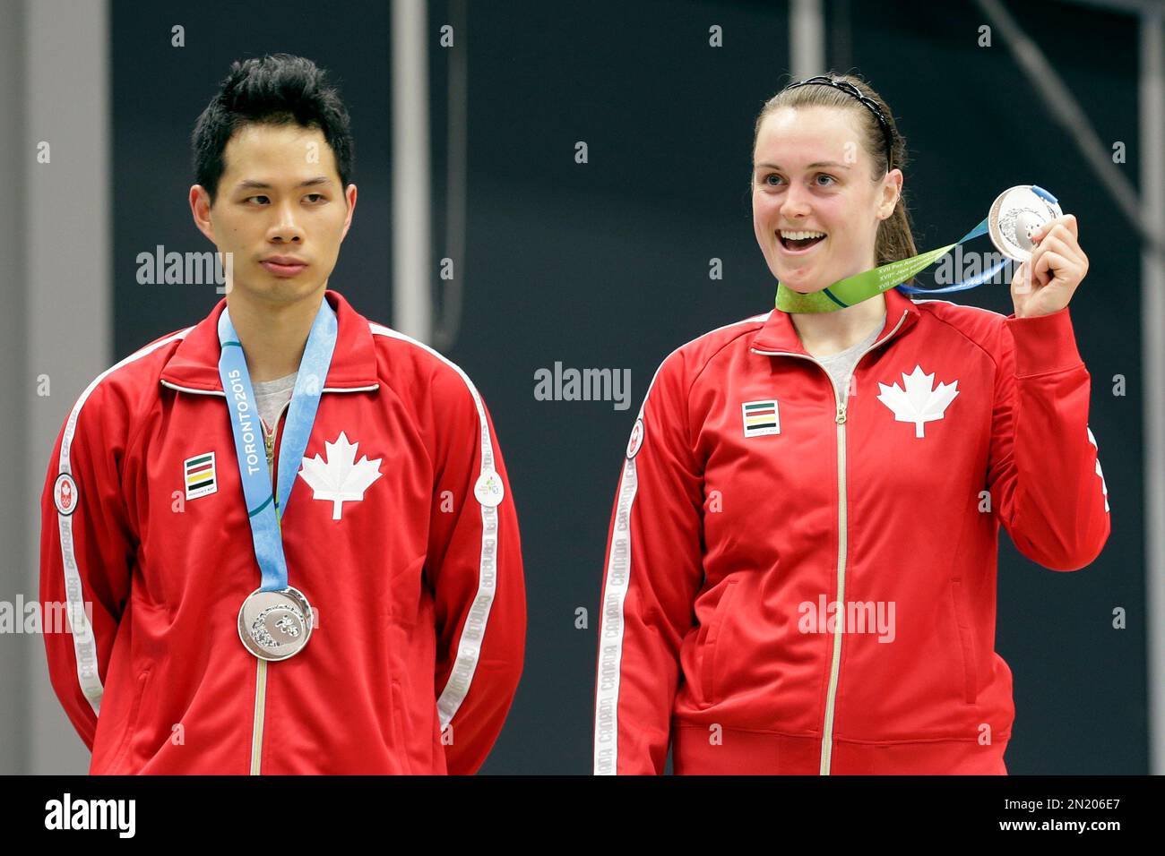 Canada's Alex Bruce, right, shows off her silver medal as her teammate ...
