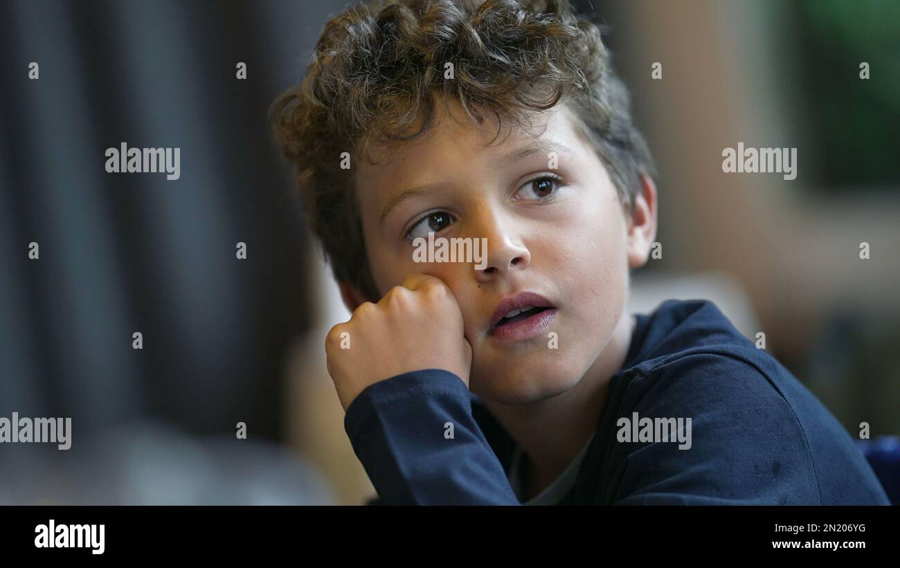 One pensive young boy thinking portrait face thoughtful kid Stock Photo ...