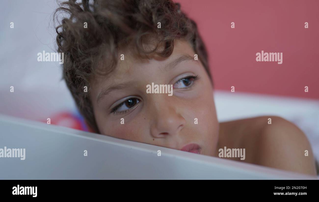 One sad preteen boy face closeup. Thoughtful kid with daze expression ...