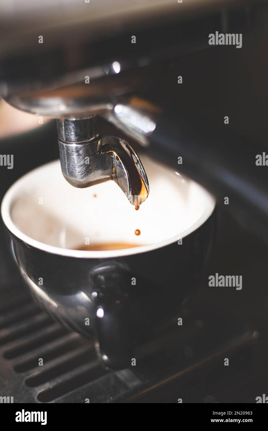 Pour coffee from professional machine hi-res stock photography and ...