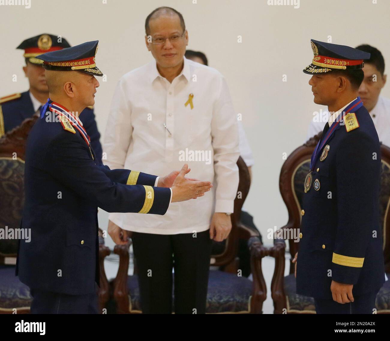 Outgoing Deputy Police Director General Leonardo Espina extends both ...
