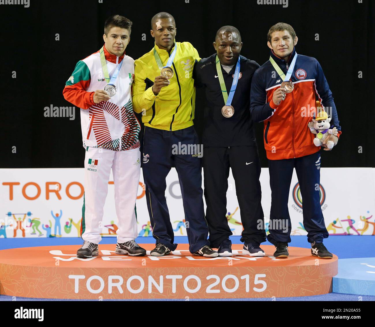 Medalists in the 59 kg men's Greco-Roman wrestling competition pose at ...