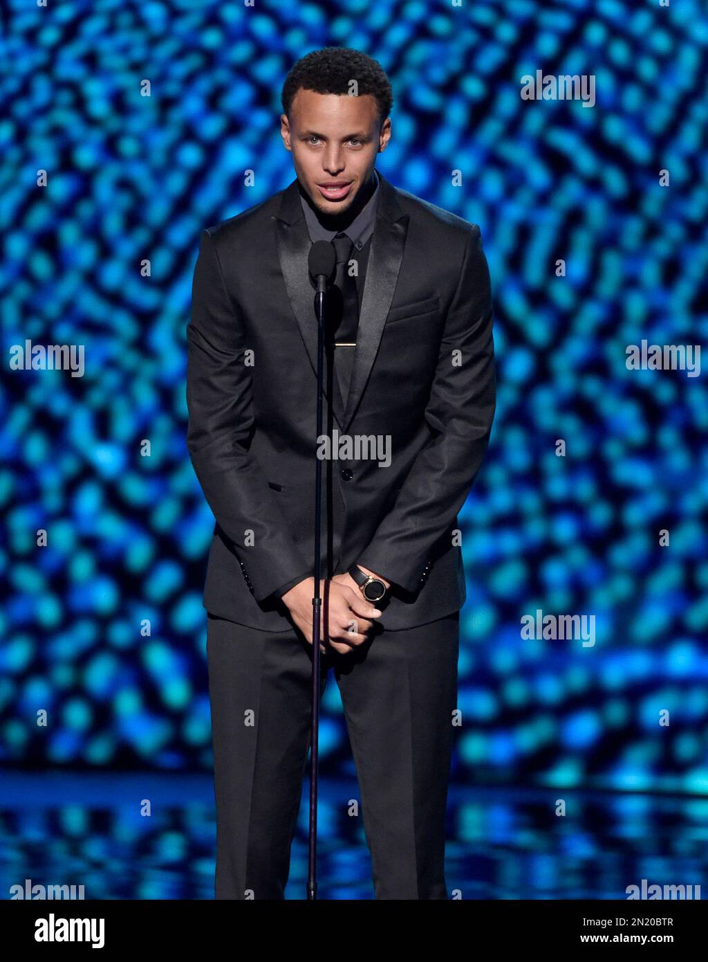 NBA player Stephen Curry, of the Golden State Warriors, presents the ...