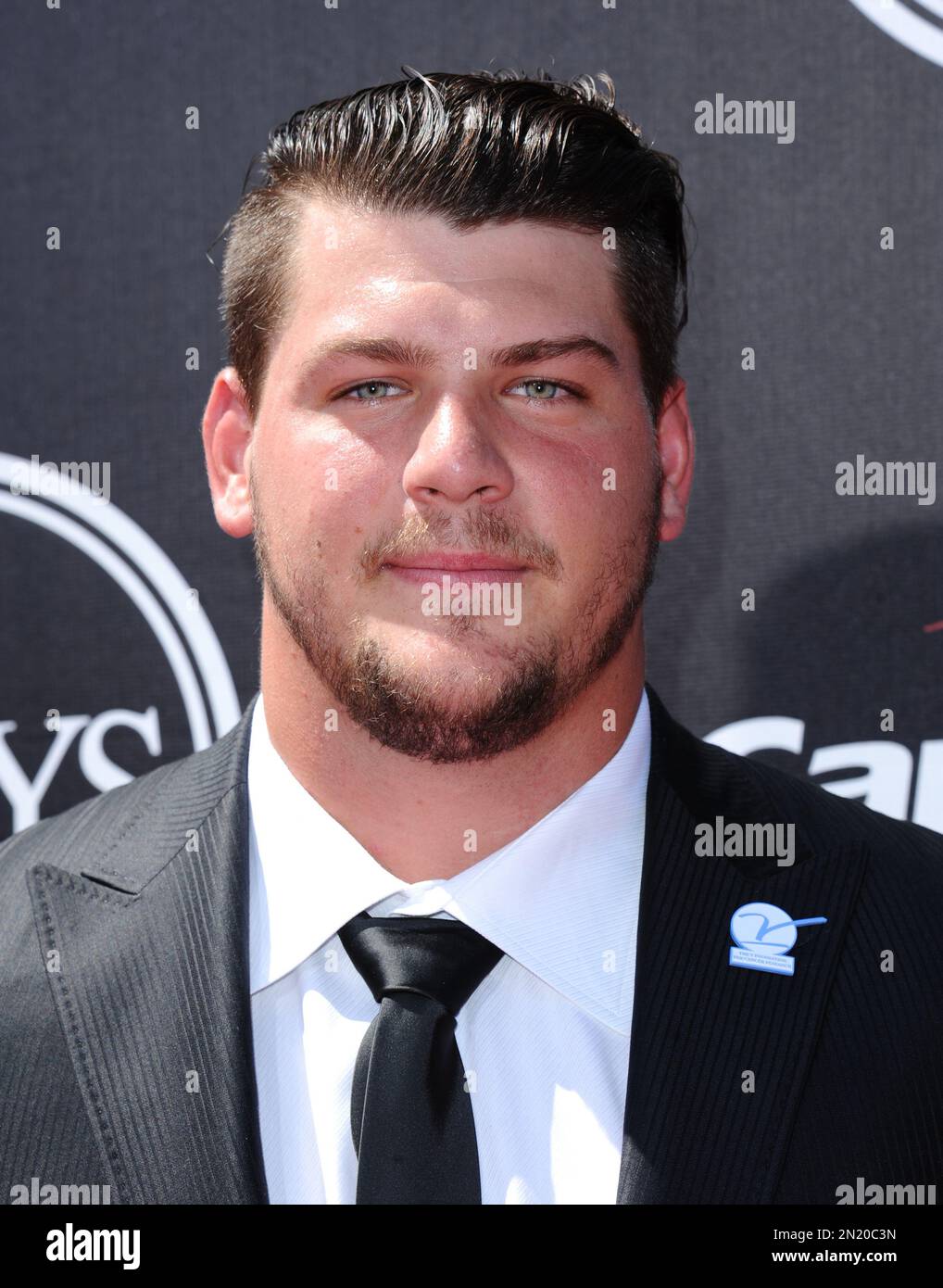 NFL player Taylor Lewan, of the Tennessee Titans, arrives at the ESPY ...
