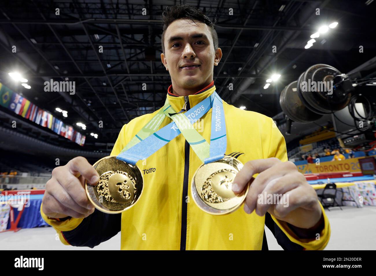 Colombia's Jossimar Calvo poses with his two gold medals, in parallel ...