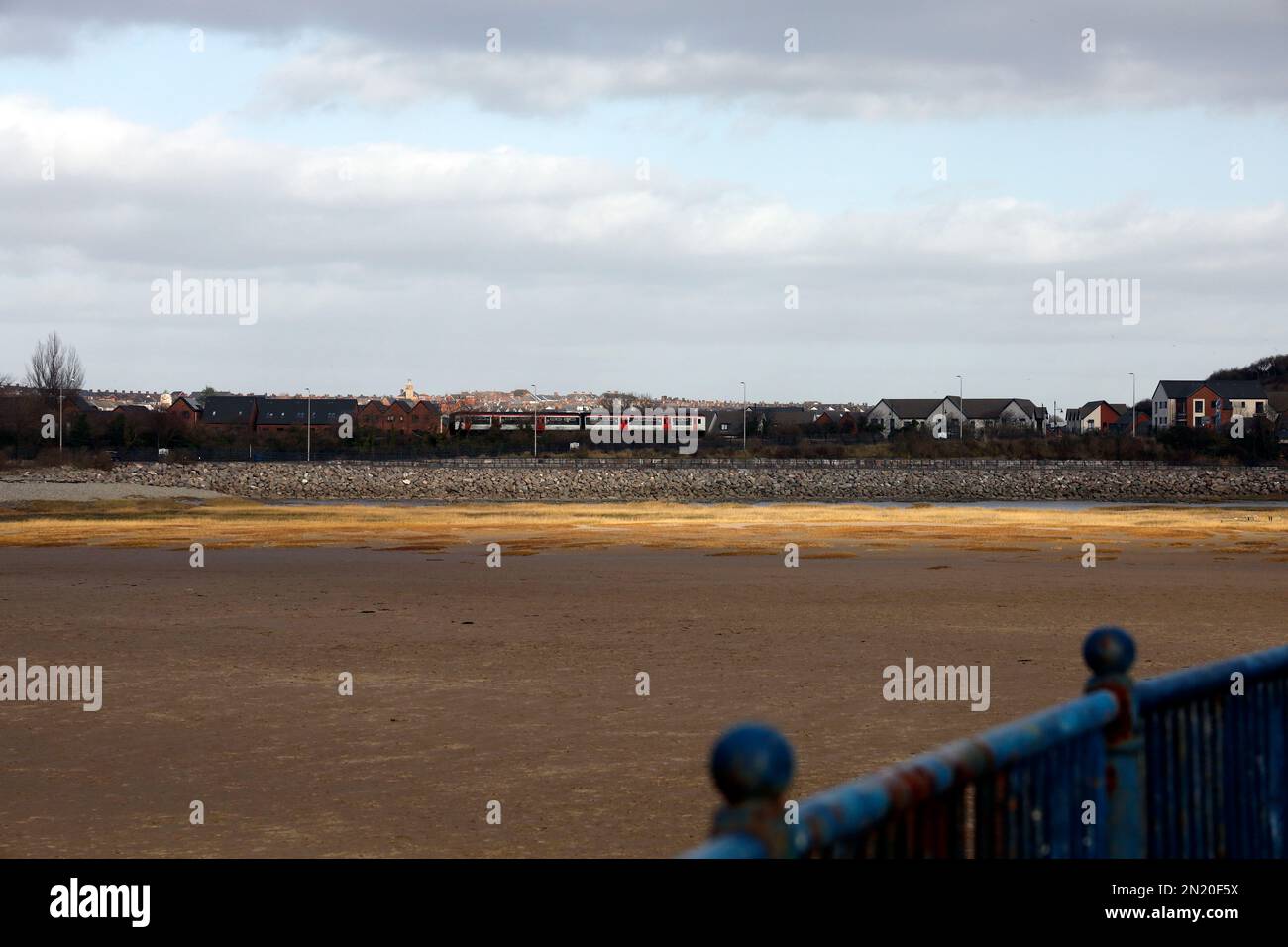 Looking across Barry Harbour and railway bridge with train. South Wales ...
