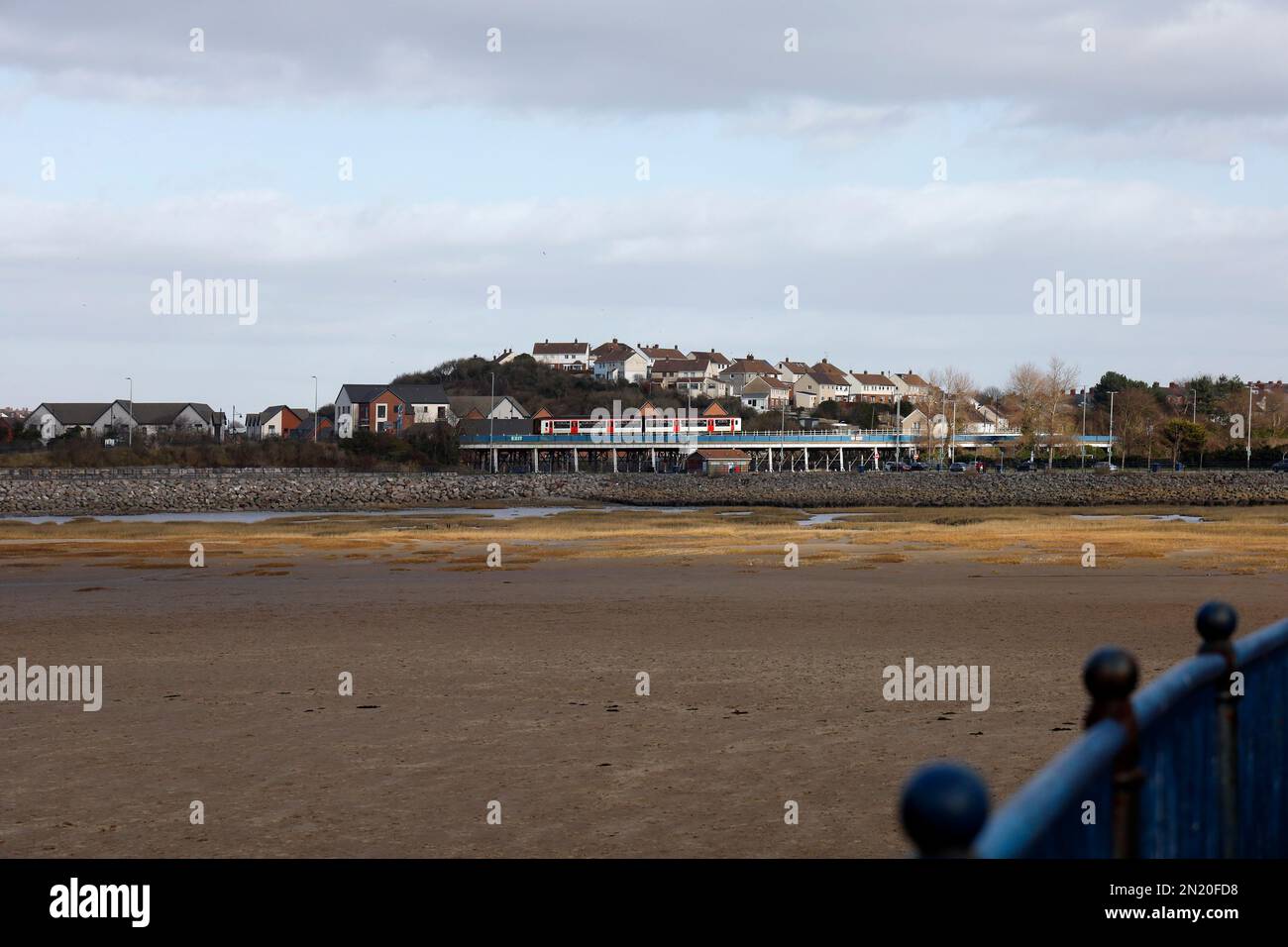 Looking across Barry Harbour and railway bridge with train. South Wales ...
