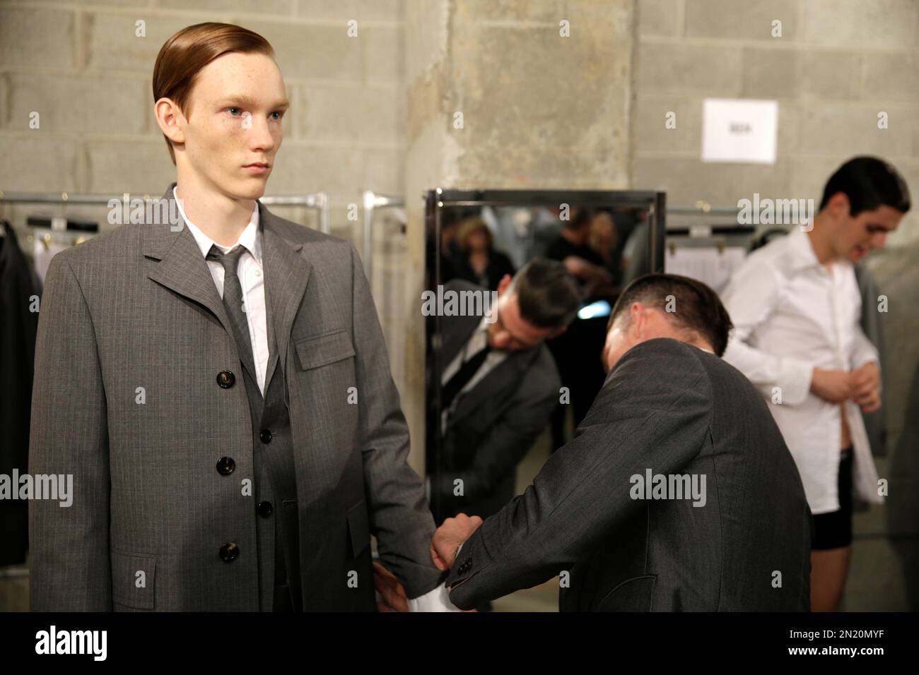 Matthew Pitt, of Ontario, Canada, gets ready backstage before a ...