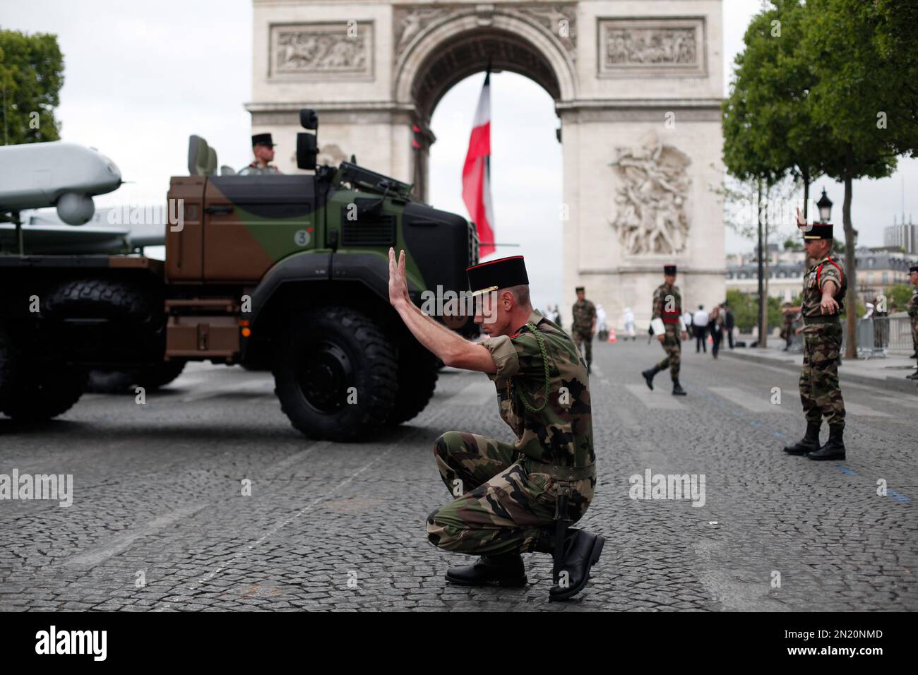 A French soldier directs a light armored vehicle prior to the ...