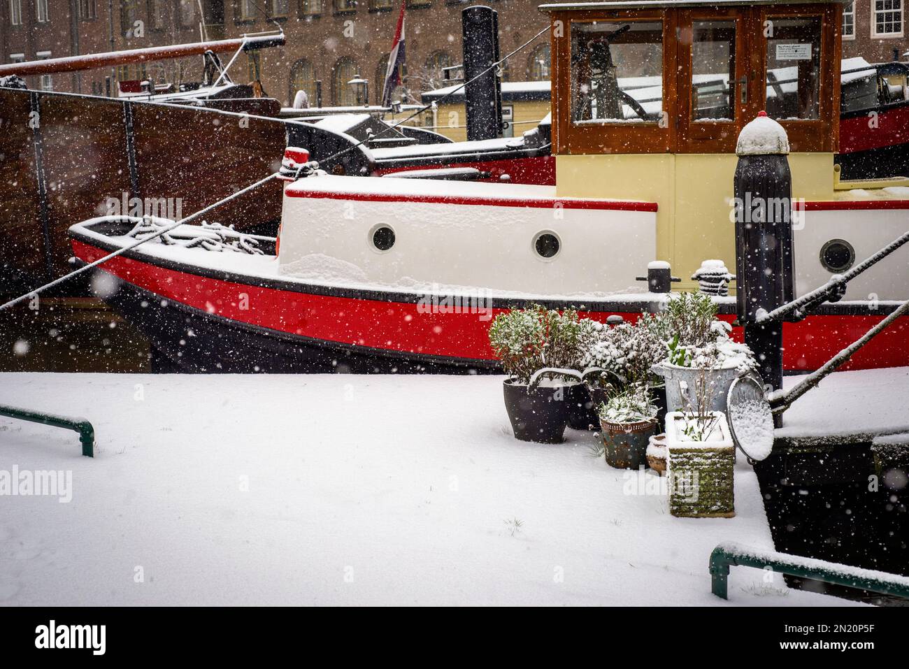 Traditional Dutch ships in harbour under the snow Stock Photo - Alamy
