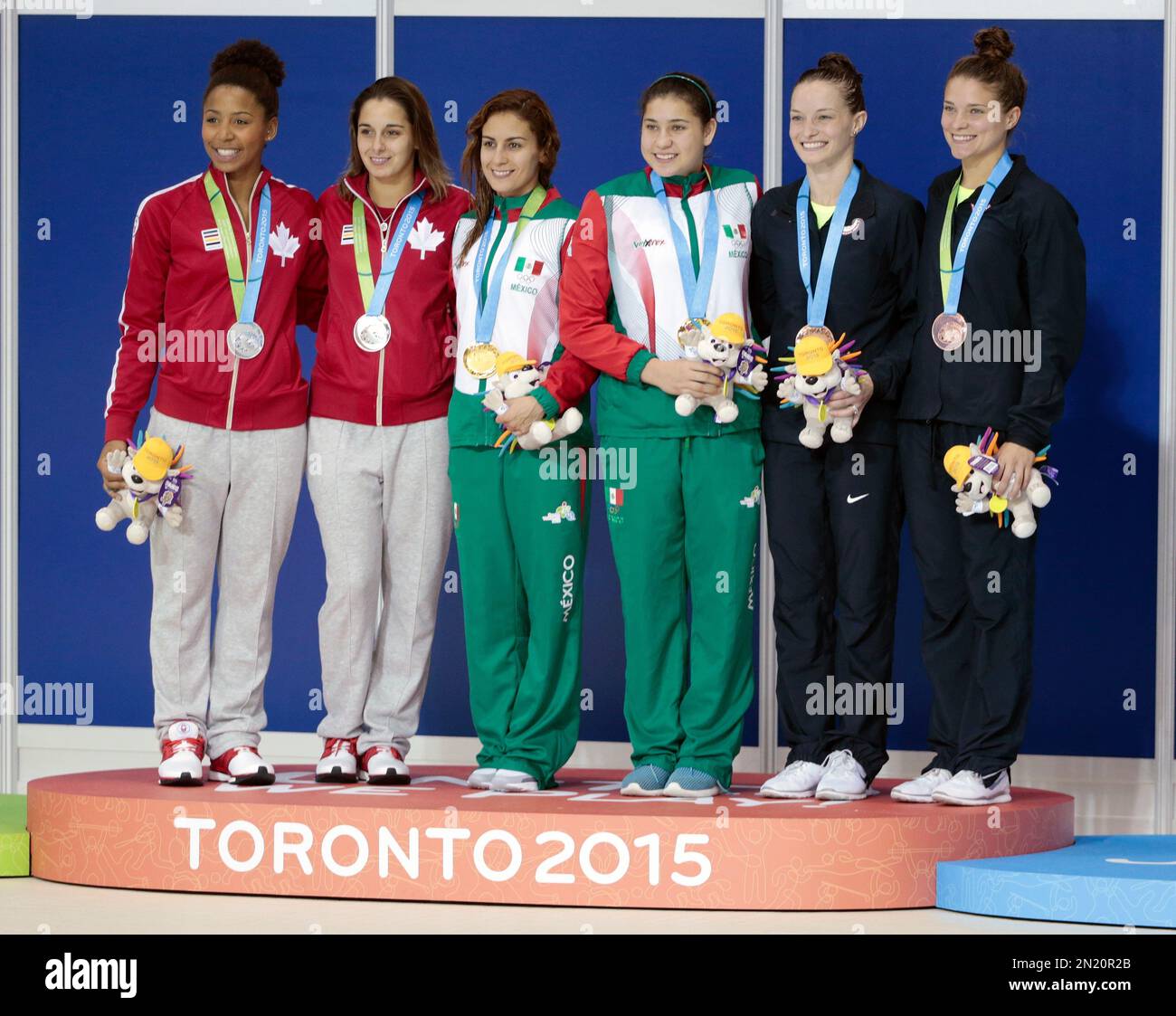 Divers pose with their medals following the women's synchronized 3 ...