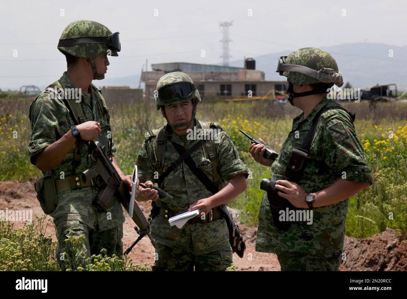 Soldiers guard the half-built house where drug lord Joaquin "El Chapo ...