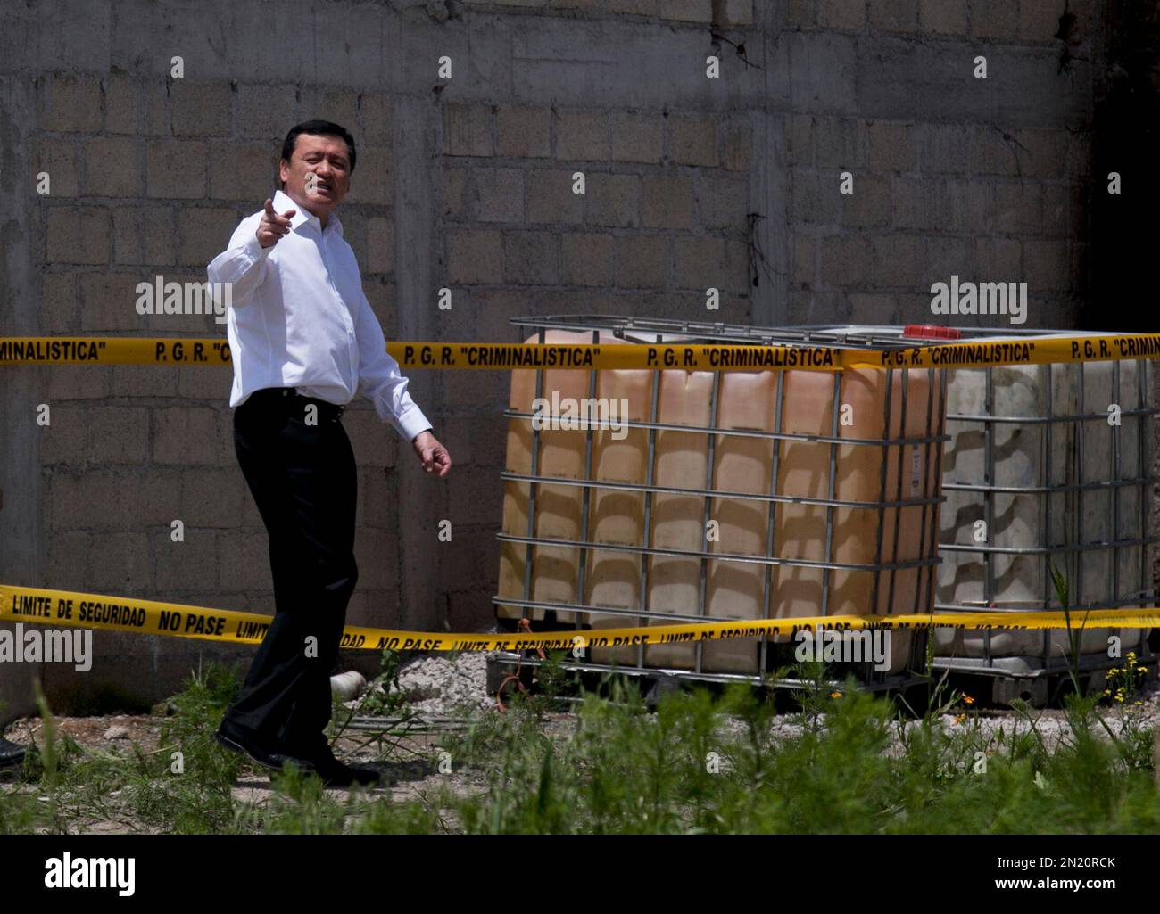 Mexico's Interior Secretary Miguel Angel Osorio Chong arrives to the half-built house where drug ...