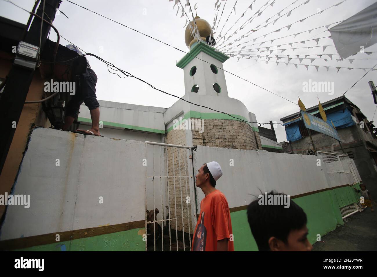 In this July 9, 2015, photo, Filipino Muslim Munib Dalidig talks to a ...