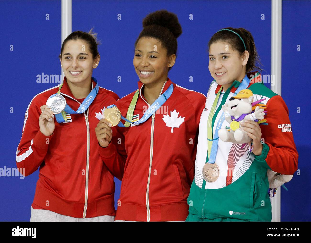 Gold medalist Jennifer Abel of Canada, center, poses with silver ...