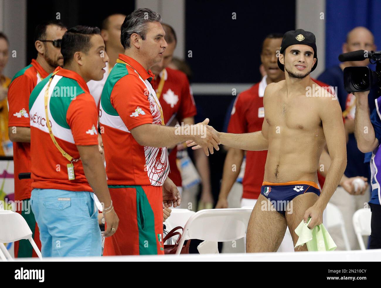 Ivan Garcia, right, of Mexico, is congratulated after winning the gold ...