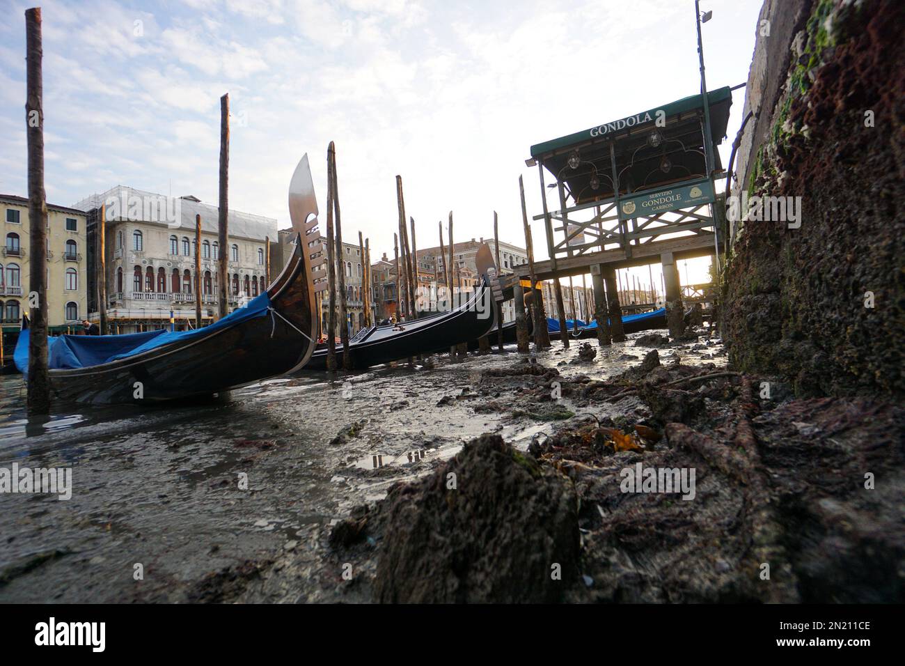 Gondolas lie on the bottom of the Grand Canal during an unusually low ...