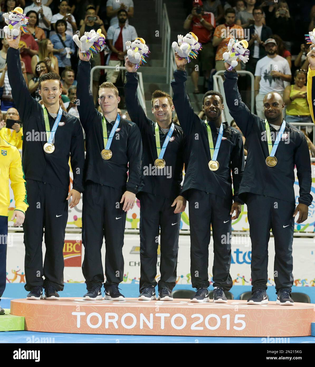 The United States' artistic gymnastics team poses with their gold ...